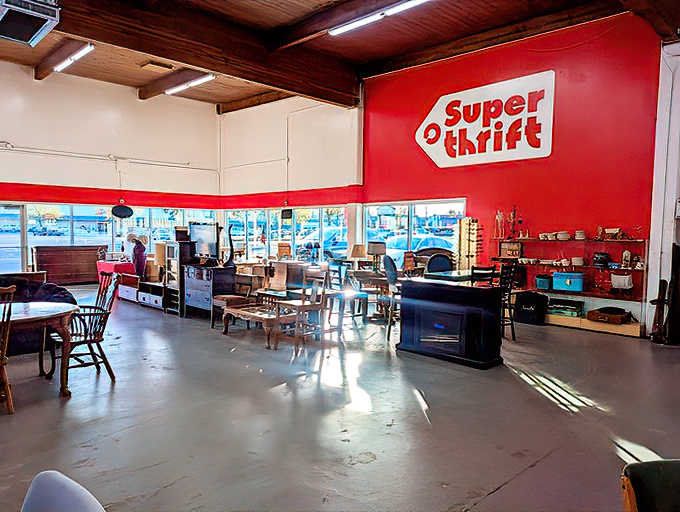 Inside, natural light floods the spacious interior, where the iconic red SuperThrift logo presides over a kingdom of second-hand treasures.