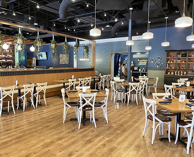 Inside, cross-back chairs and hanging plants create that perfect balance between "fancy enough for date night" and "comfortable enough for elastic waistbands."