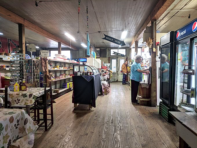Worn wooden floors that have supported generations tell their own stories as customers browse shelves stocked with both necessities and nostalgia.