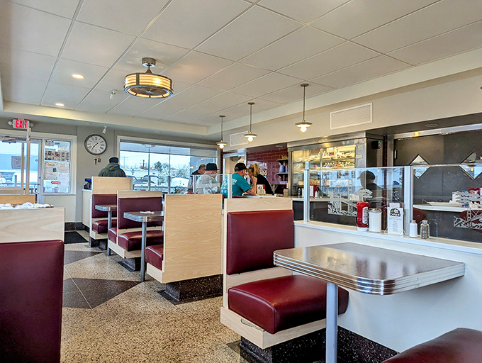 Classic burgundy booths and gleaming countertops&mdash;this isn't just retro-chic design, it's a time machine where calories don't count and coffee refills are infinite.