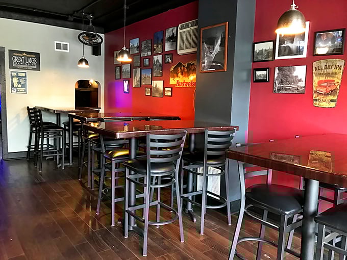 Red walls adorned with local memorabilia create the perfect backdrop for conversations that flow as smoothly as the draft beer.