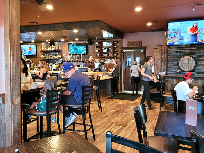 Inside, the warm wood-paneled interior strikes that perfect balance between mountain lodge coziness and "I can still hear what my dinner companion is saying."
