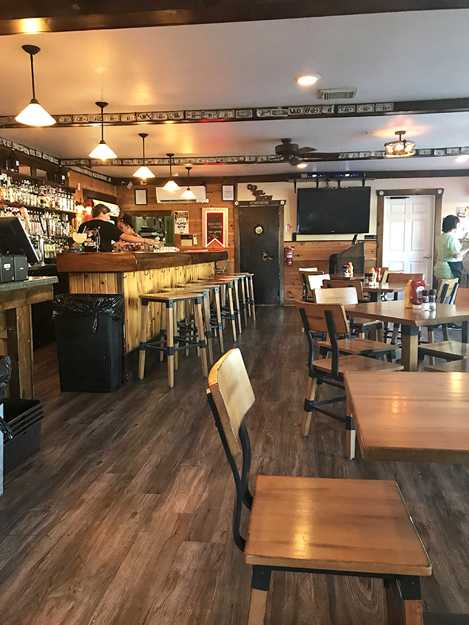 Inside, warm wood paneling and pendant lighting create that perfect "everybody knows your name" vibe. The bar beckons with promises of pre-steak libations.