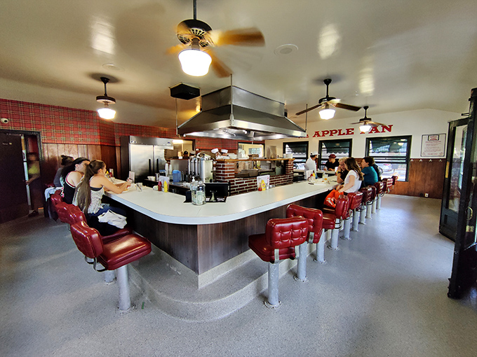 Step inside and you're transported to mid-century America &ndash; red vinyl stools, horseshoe counter, and not a smartphone charging station in sight. This isn't retro by design; it's authentic by survival.