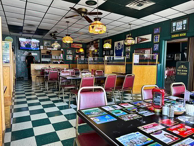 Classic black and white checkered floors lead you through a time portal where Tiffany-style lamps cast a warm glow over conversations that matter.