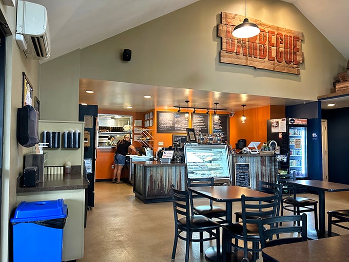 Inside, the rustic "BARBECUE" sign announces the mission statement with all the subtlety of a smoke signal. No confusion about priorities here.