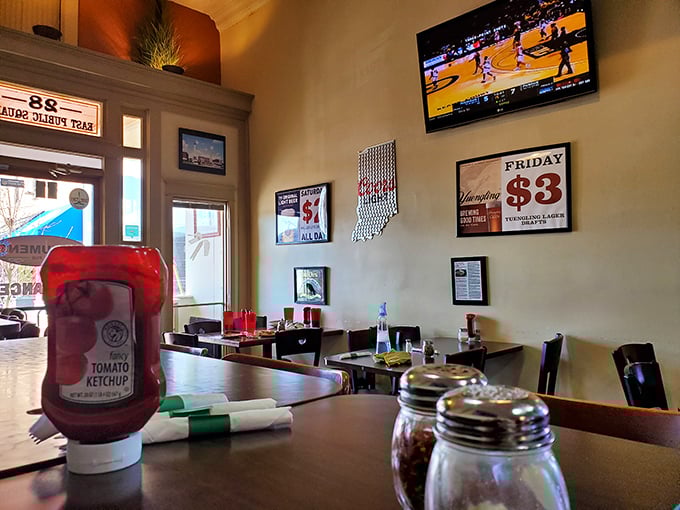 Inside, the cozy dining room balances small-town warmth with modern pub vibes &ndash; note the Indiana-shaped bottle opener on the wall! 