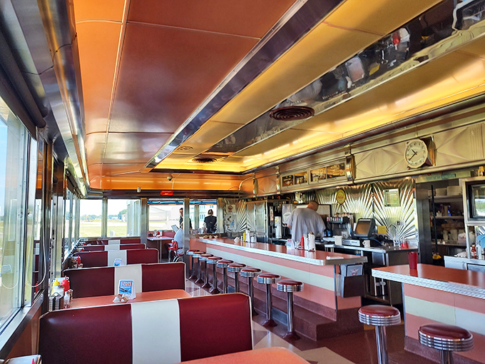 Step inside and suddenly you're starring in your own 1950s sitcom. Red vinyl booths and chrome accents create the perfect backdrop for your impending food coma.