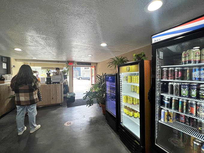 Inside, simplicity reigns supreme. The compact space prioritizes function over frills, with refrigerated cases standing ready to quench post-sandwich thirst.