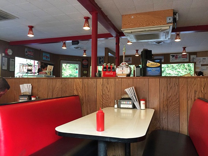 Classic red vinyl booths and wood paneling create a time capsule where calories don't count and conversations flow as freely as the coffee.