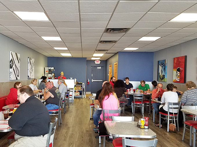 Inside, the no-frills dining room buzzes with conversation and the clinking of silverware &ndash; the soundtrack of breakfast happiness in progress.