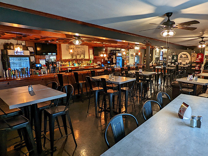 Industrial-chic meets comfort in this welcoming dining space. The warm wood tones and metal accents create the perfect backdrop for serious meat appreciation.