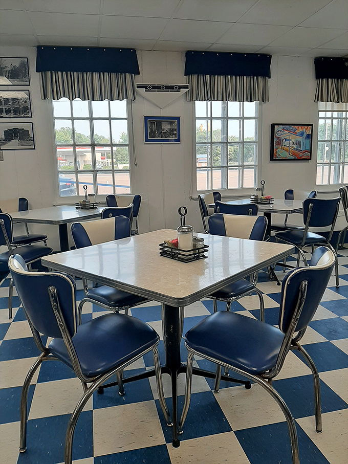 Step into a slice of Mississippi nostalgia with the classic blue and white checkerboard floor that perfectly matches those chrome-trimmed tables and vinyl chairs.