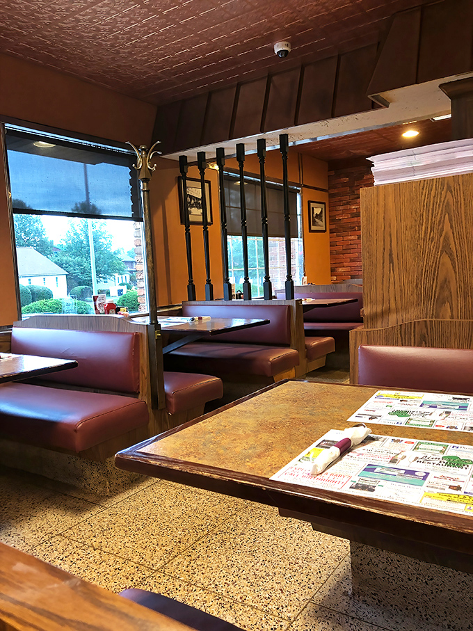 Classic booth seating and warm wood paneling create the perfect backdrop for memorable meals and meaningful conversations.