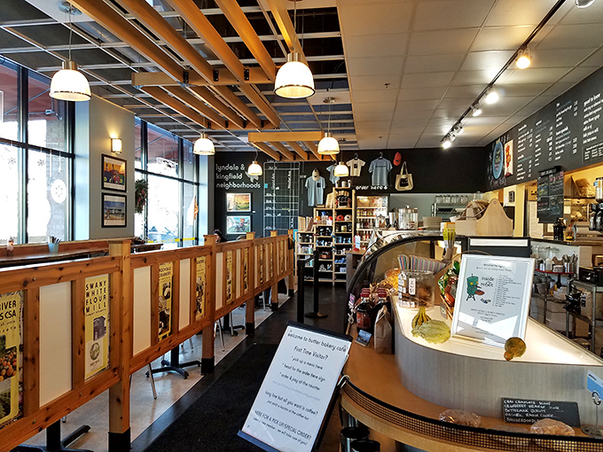 Wooden booths and warm lighting create the perfect backdrop for both serious conversations and lighthearted banter over exceptional baked goods.