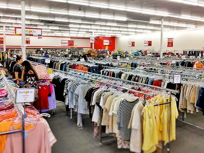 A sea of clothing racks stretches toward the horizon, organized with military precision. The thrill of the hunt begins here!