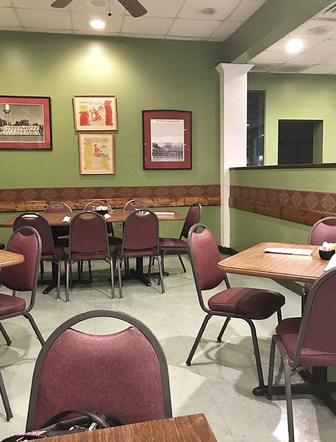 Green walls adorned with local memorabilia create that "been here forever" vibe that always signals good food is coming your way.