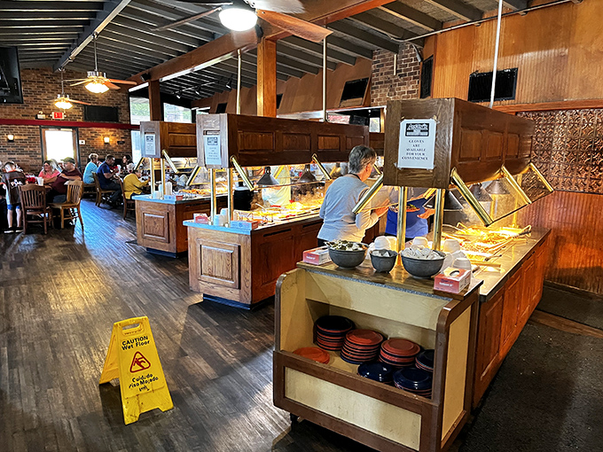 Wooden buffet stations stretch like a culinary yellow brick road, leading diners to comfort food nirvana. The warm interior practically whispers "take another helping."