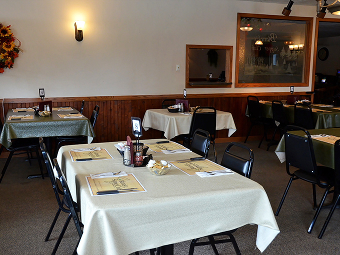 Classic Wisconsin supper club ambiance with wood-paneled walls and white tablecloths &ndash; comfort and tradition served alongside every meal.