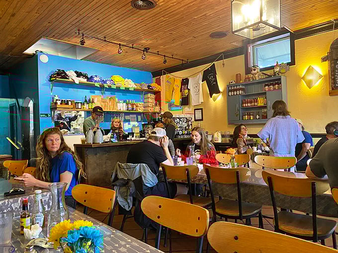 Inside, wooden ceilings and blue walls create that "everybody becomes friends by the second coffee refill" atmosphere that defines the best diners.