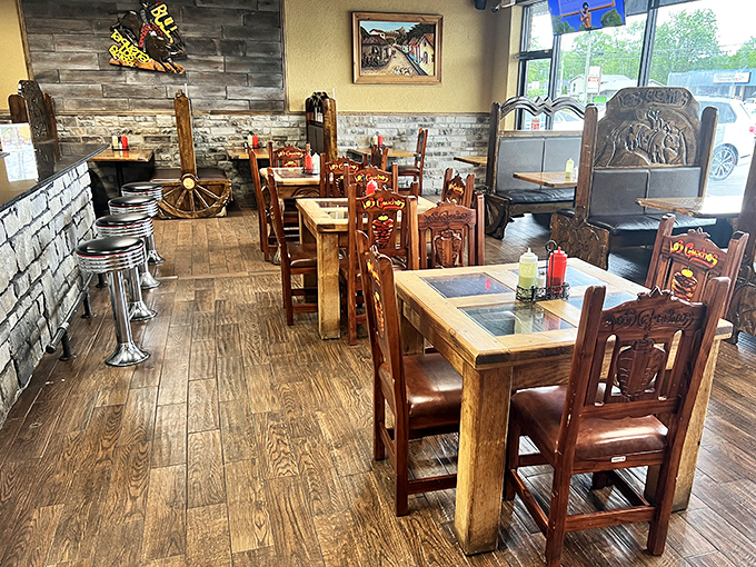 Rustic wooden tables and hand-carved chairs create an atmosphere that's both authentic and inviting. The stone accents transport you straight to Mexico.