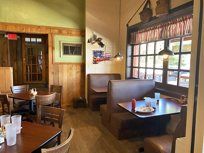Classic diner booths and wooden paneling create that "grandma's kitchen" feeling we all crave. Notice the Americana touches that say "sit down, stay awhile."