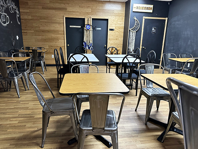 The modern interior combines chalkboard walls with dreamcatchers, creating a space that says "yes, we take waffles seriously, but we're having fun doing it."