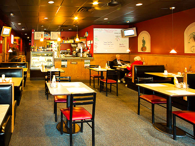 Inside, warm russet walls and wood paneling create that perfect diner ambiance where time slows down and conversations flow as freely as the coffee.