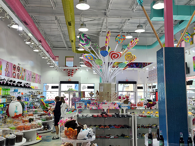 Stepping inside reveals a whimsical explosion of color where lollipop trees sprout from the ceiling and childhood dreams come to life.