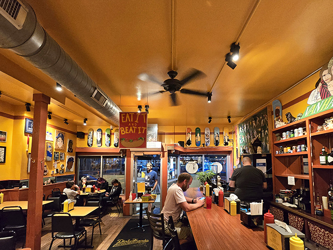 Step inside and the vibrant yellow walls become a gallery of pop culture, where hot dogs are celebrated with the reverence usually reserved for fine art.