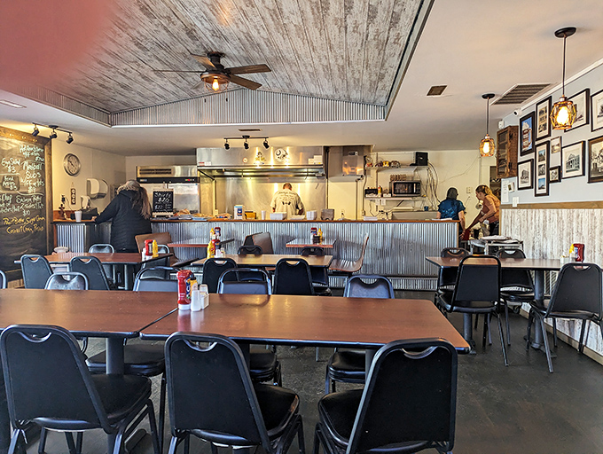 Inside, corrugated metal meets rustic wood, creating that perfect diner atmosphere where comfort trumps pretension every time.