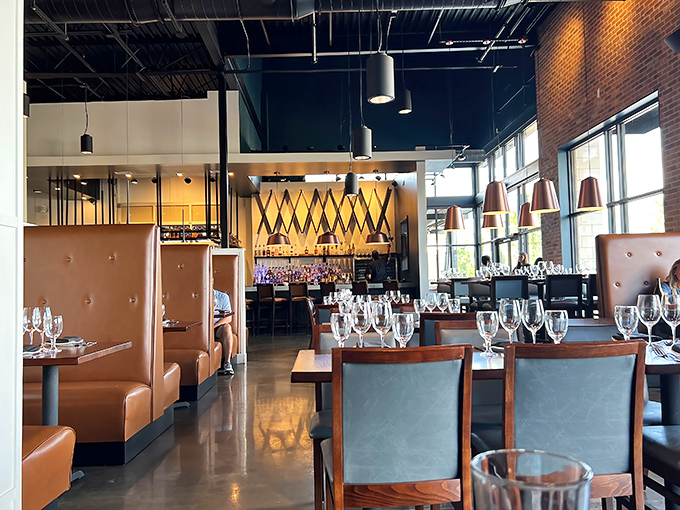 The interior strikes that perfect balance—sophisticated enough for special occasions yet comfortable enough to become your regular haunt. Those leather booths practically whisper, "Stay awhile."