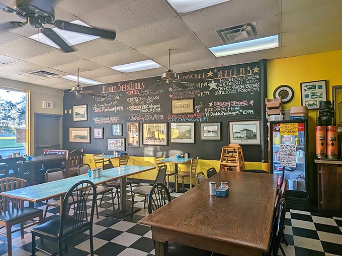 Yellow walls and a chalkboard menu create the perfect backdrop for breakfast magic. This isn't designer decor&mdash;it's authentic diner DNA.