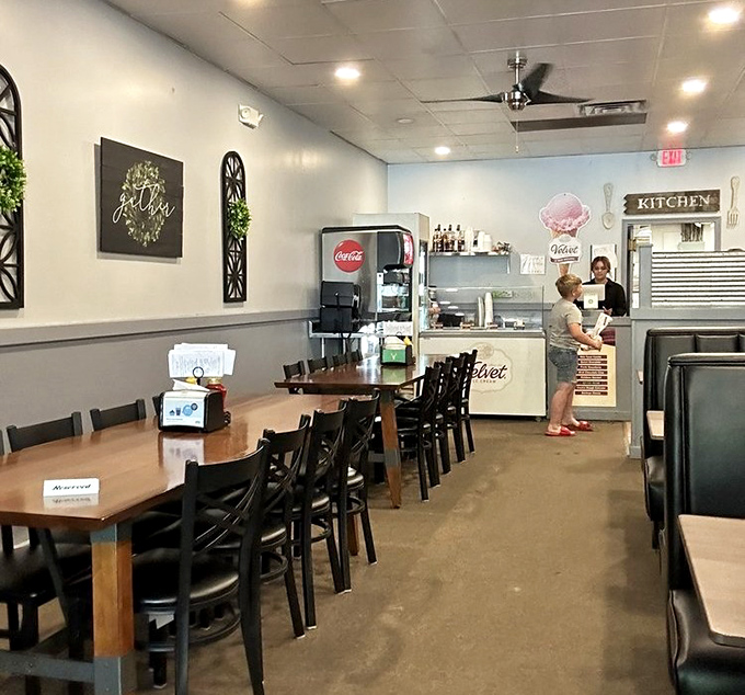 Simple, clean, and welcoming&mdash;the interior speaks volumes about Reindeer Grill's philosophy: focus on the food, not the frills. The "gather" sign says it all.