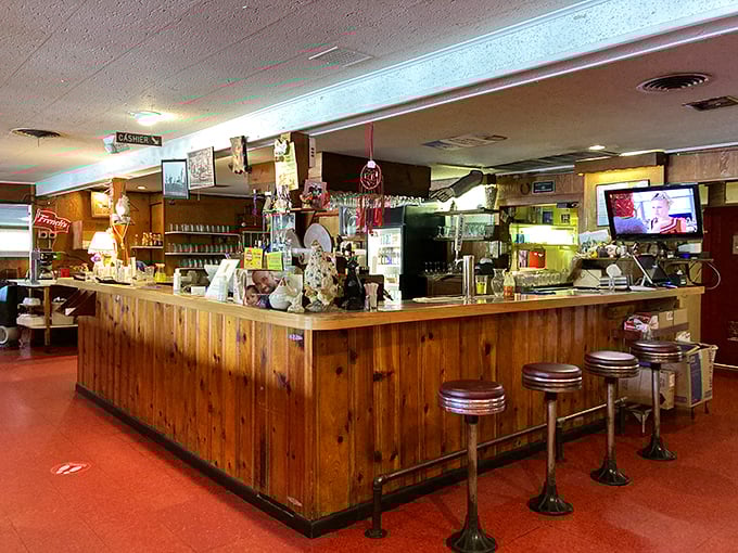 Step back in time at the wood-paneled counter where generations of Nebraskans have perched on these stools, eagerly awaiting golden-brown delights.