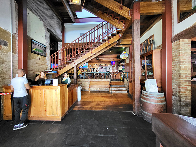 Where rustic meets refined. Exposed brick, wooden beams, and that staircase that's carried thousands of diners toward culinary bliss upstairs.