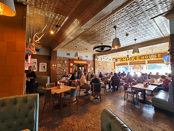 Step inside to discover a rustic-industrial haven where the pressed tin ceiling, warm lighting, and bustling atmosphere create the perfect backdrop for culinary magic.