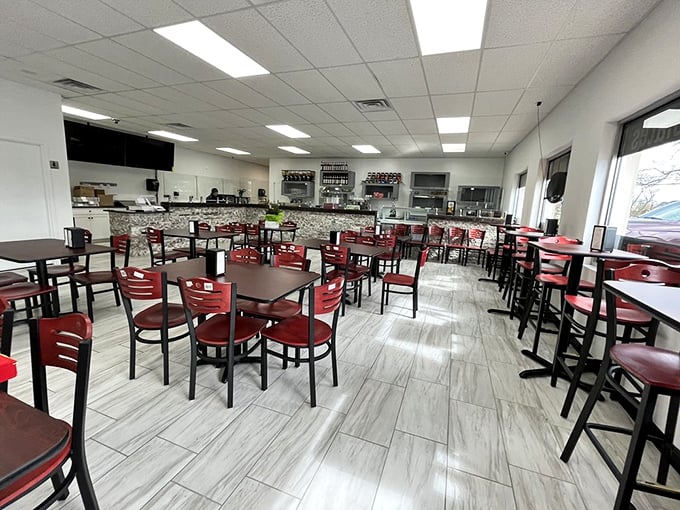 Clean lines, bright lights, and those cherry-red chairs practically whisper, "Sit down, stay awhile, and contemplate the meaning of dessert."