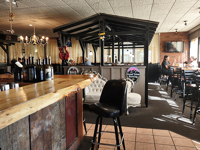 Rustic wooden beams frame the inviting interior, where comfort meets craftsmanship. The kind of place where conversations flow as smoothly as the drinks.