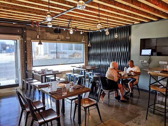 Industrial-chic meets comfort in Carson Kitchen's dining room. Those wooden ceiling beams have witnessed countless food epiphanies and first-date magic.