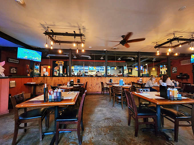 Warm wood paneling, rustic lighting, and comfortable seating create that perfect "everybody knows your name" atmosphere where memories are made between bites.