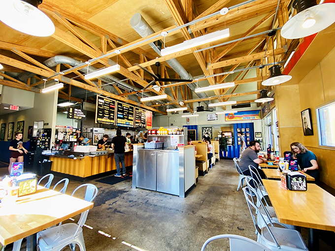 Industrial-chic meets comfort food haven. The exposed wooden beams and open layout create an atmosphere where both hipsters and grandparents feel equally at home.