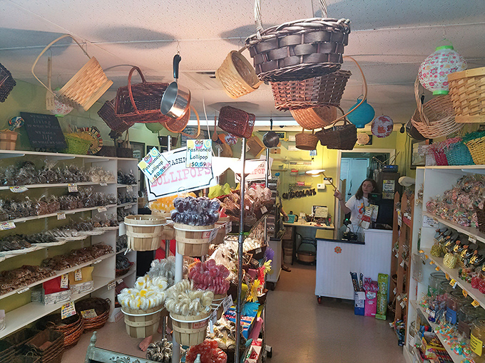 Baskets dangle from the ceiling like confectionery chandeliers, while every inch below brims with colorful treats that would make Willy Wonka jealous.