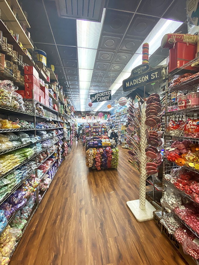 Narrow aisles create a candy canyon effect, with street signs overhead guiding you through this sugary metropolis of treats from around the world.
