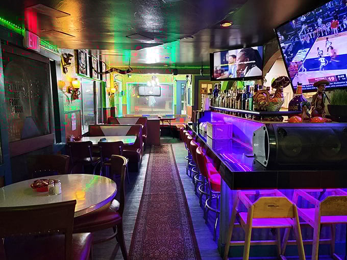 Step inside to a kaleidoscope of neon lights and cozy booths. The bar's purple glow promises margaritas that might just make you forget about that mountain hike.
