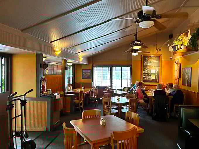 Cozy wooden tables, warm lighting, and ceiling fans create that perfect "neighborhood gem" atmosphere where conversations flow as easily as the drinks.