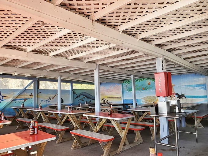 Picnic tables under latticed ceilings create the perfect no-frills dining room. Who needs fancy chandeliers when you've got ocean breezes and the promise of fresh seafood?
