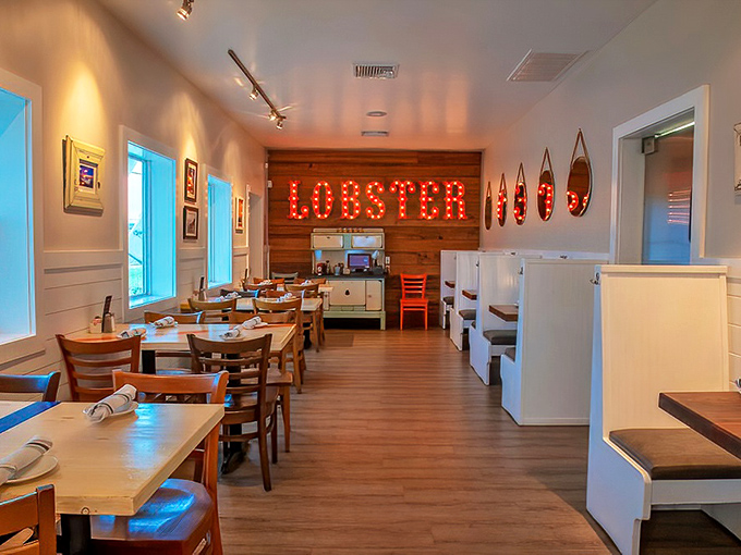 That glowing "LOBSTER" sign isn't just decor&mdash;it's a beacon calling seafood lovers home to a space where coastal comfort meets culinary excellence.