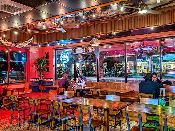Inside, wooden tables bask in the warm glow of string lights and neon signs. The perfect backdrop for the flavor fiesta about to unfold.