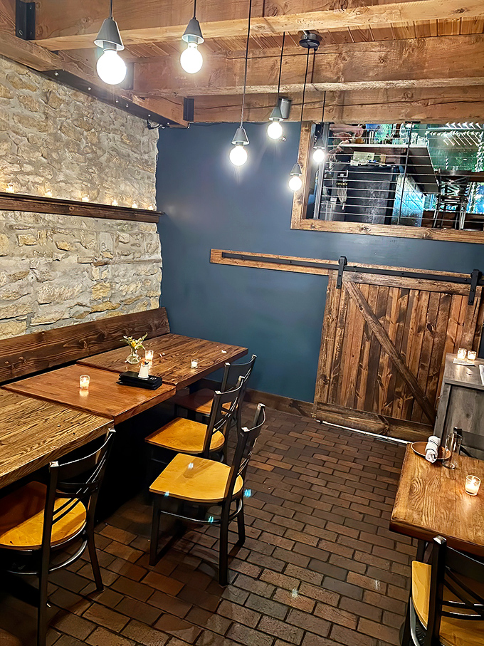 Rustic stone walls meet modern blue accents in this cozy dining space. The perfect backdrop for seafood that's anything but ordinary.